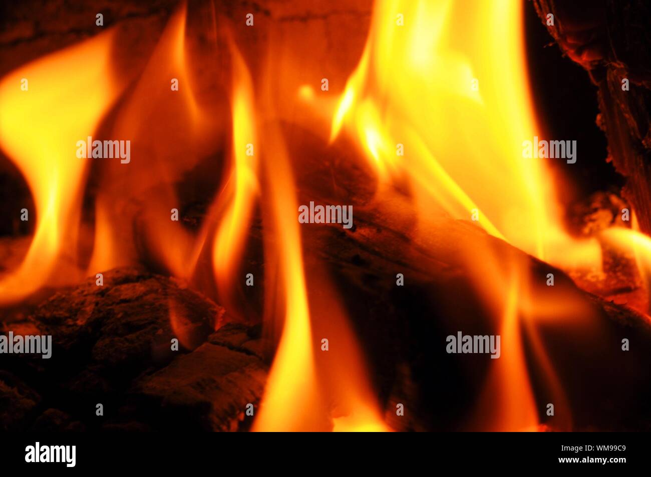 warm or hot fire flame in yellow and red colors Stock Photo - Alamy
