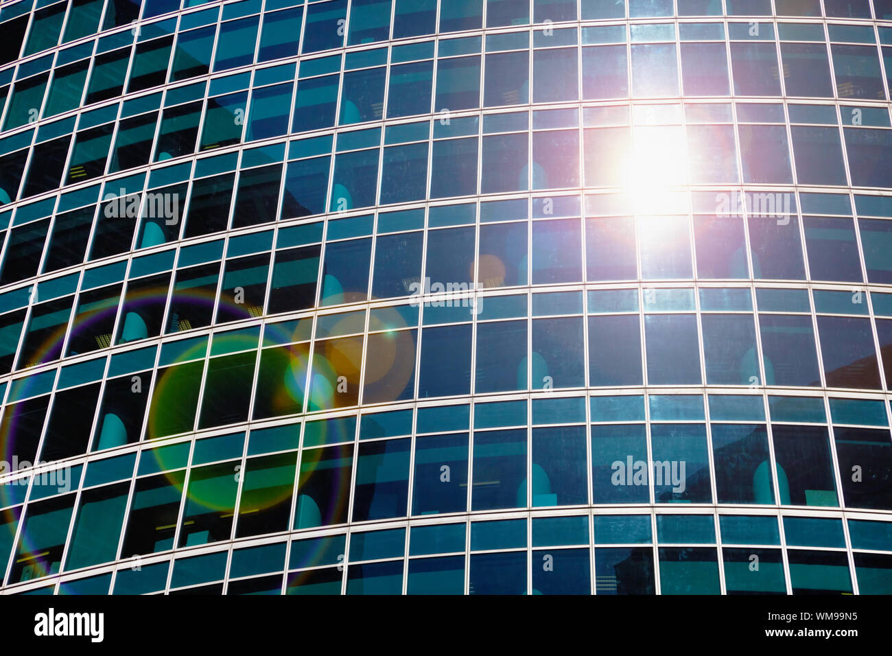 Abstract form - a skyscraper windows and solar flare Stock Photo - Alamy