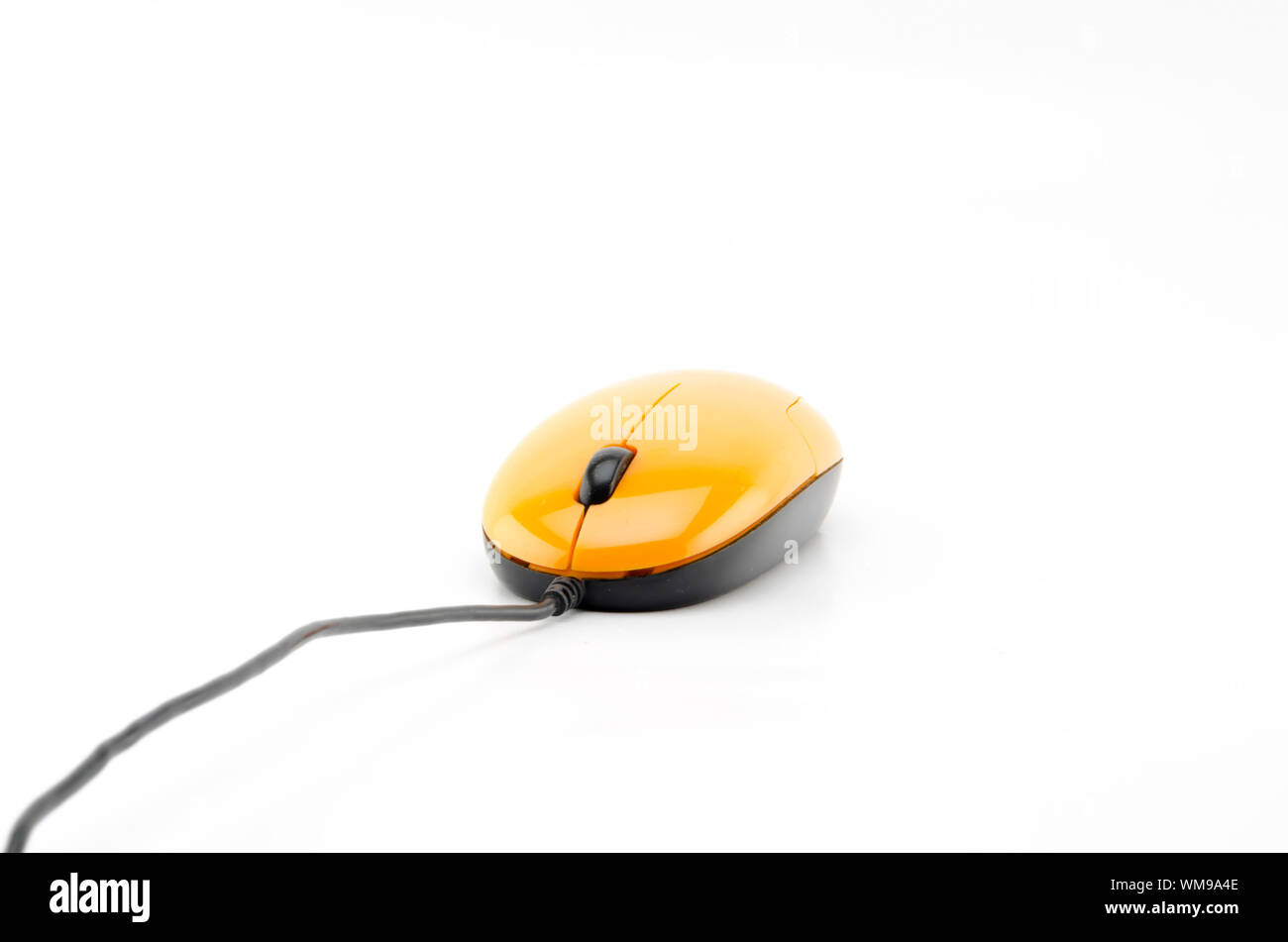 orange computer mouse isolated on white background Stock Photo - Alamy