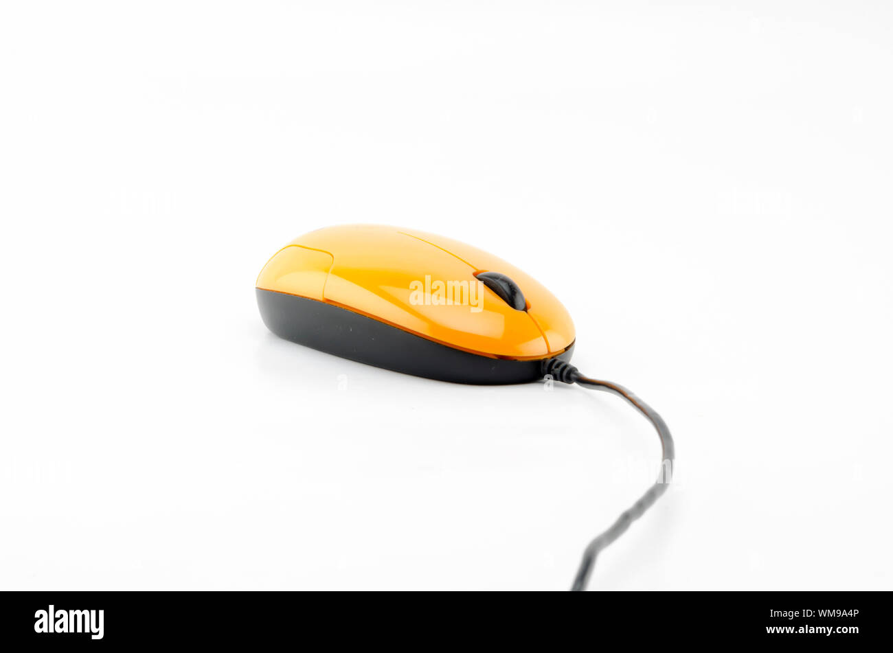orange computer mouse isolated on white background Stock Photo - Alamy