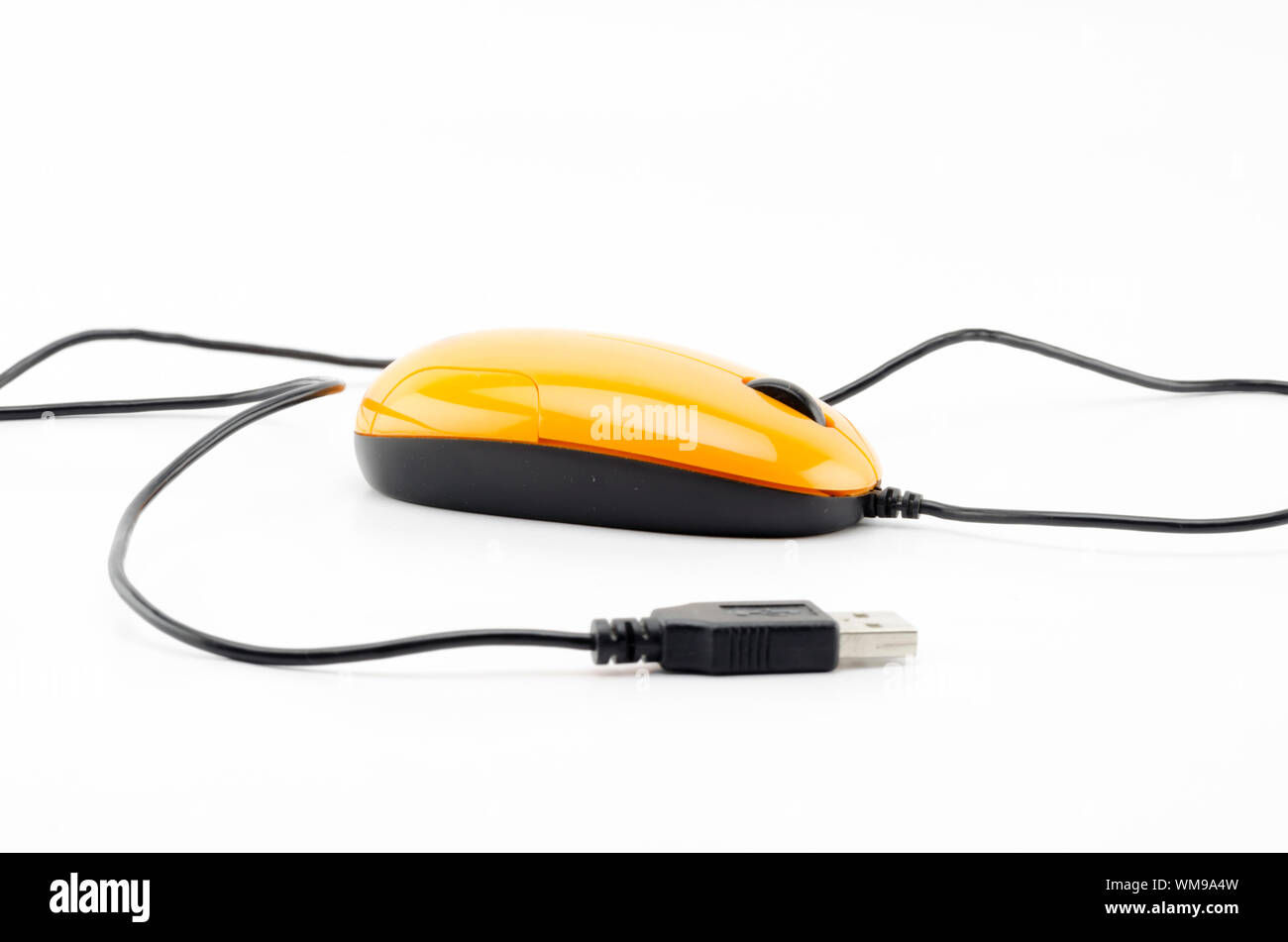 orange computer mouse isolated on white background Stock Photo - Alamy