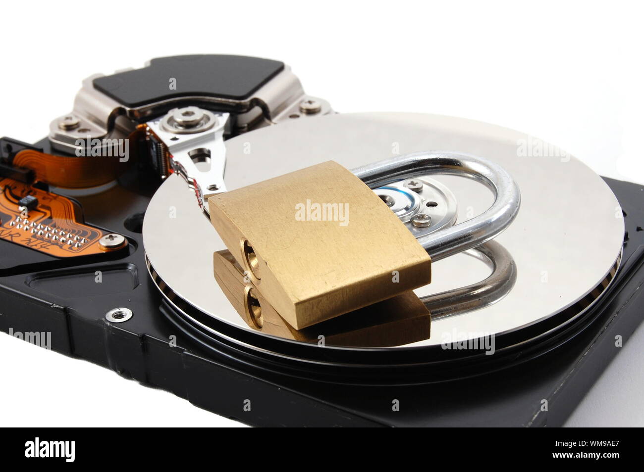 computer hard disk drive and a padlock isolated on white background ...