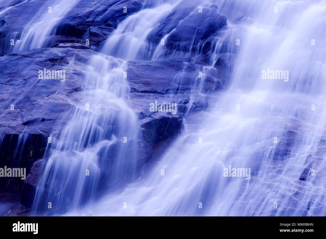 Waterfall in japanese garden, blue tone Stock Photo - Alamy