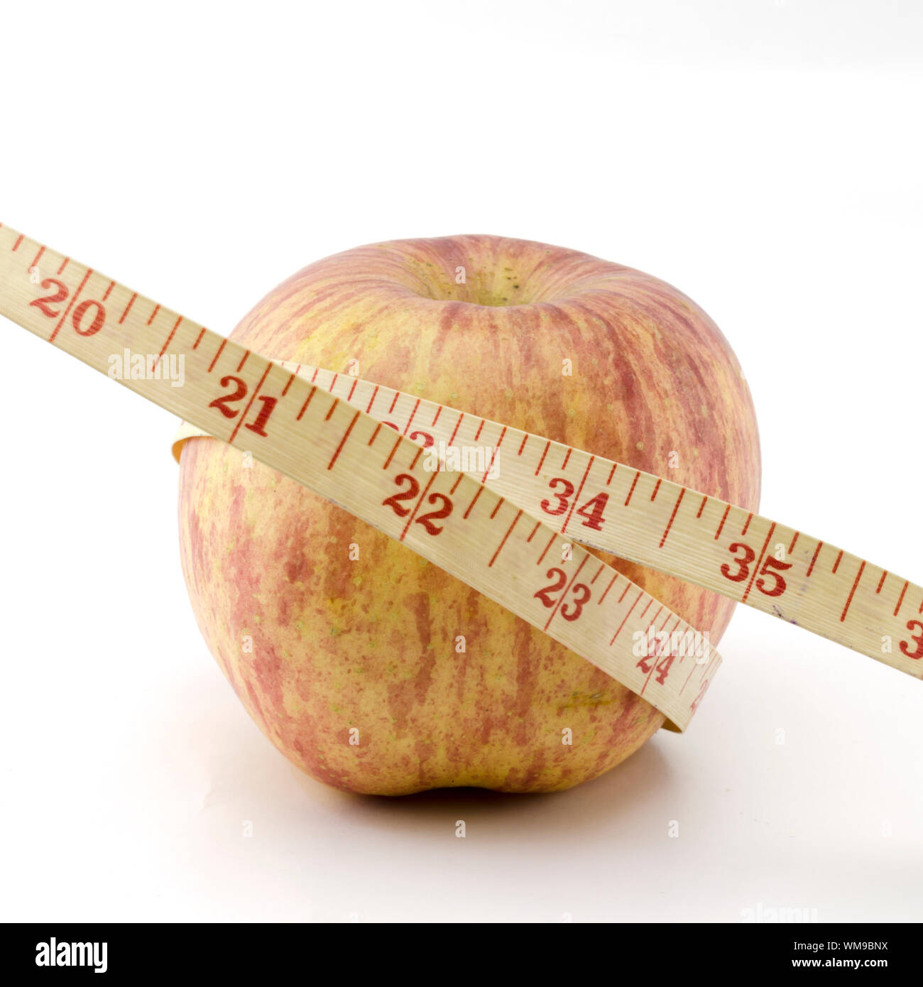 red apple with measuring tape isolated on white background Stock Photo ...