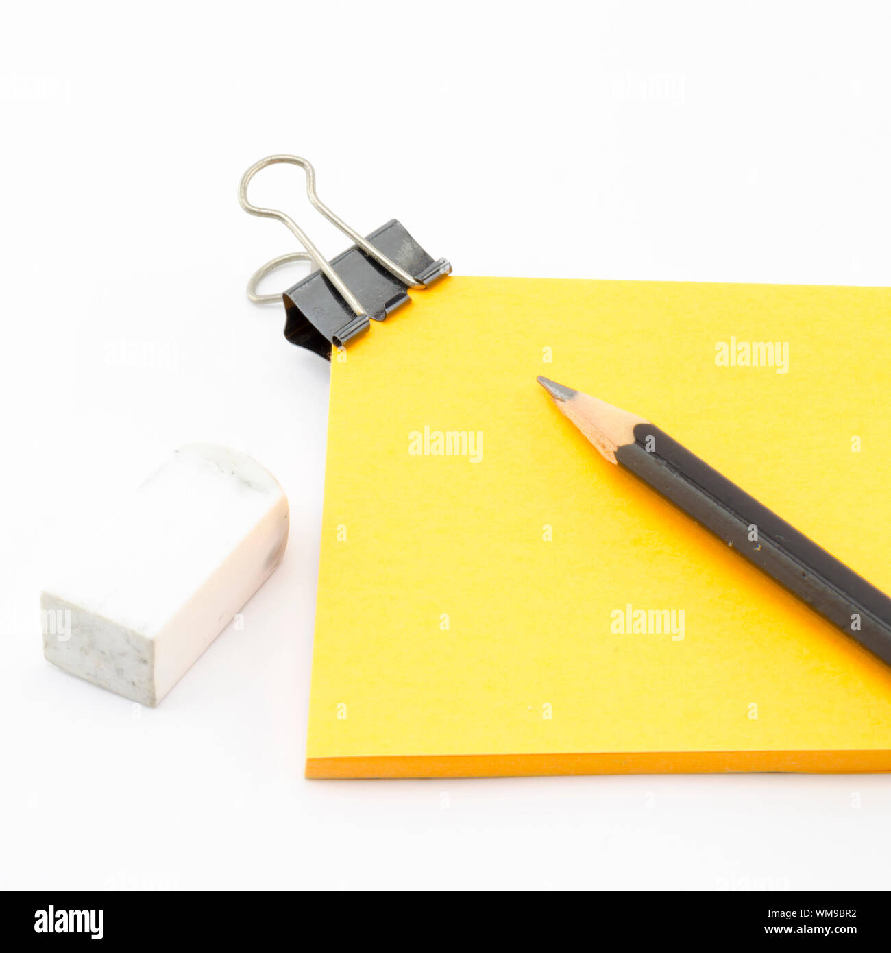 orange sticky note with black pencil isolated on white background Stock ...