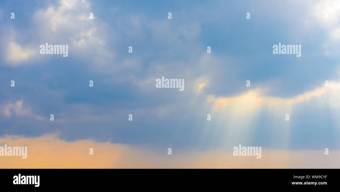 Beautiful Blue Stormy Sky with Sun Rays. Bright Beams Through the ...