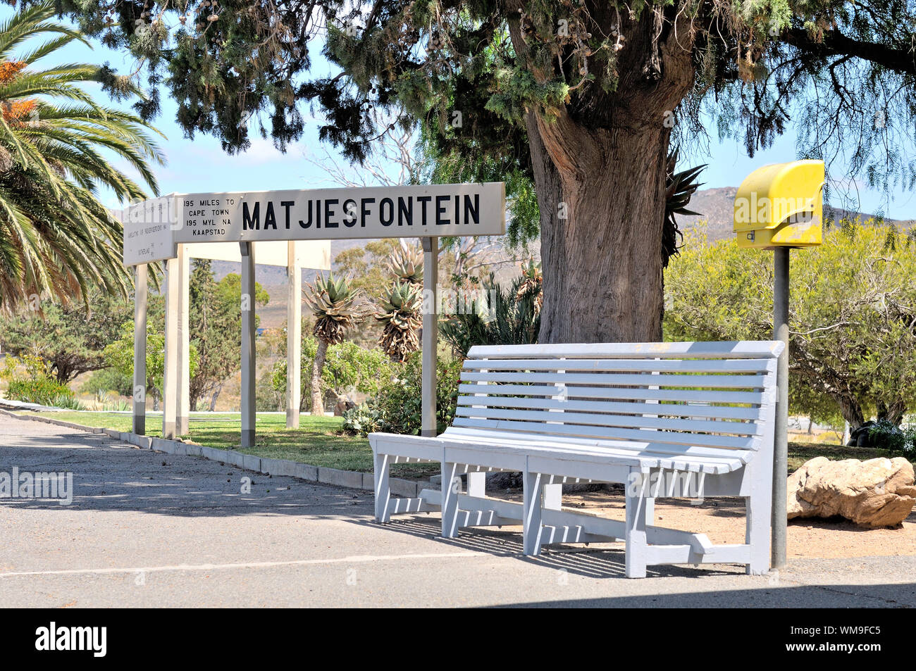 Bench and sign at the historical Matjiesfontein station in the Western ...