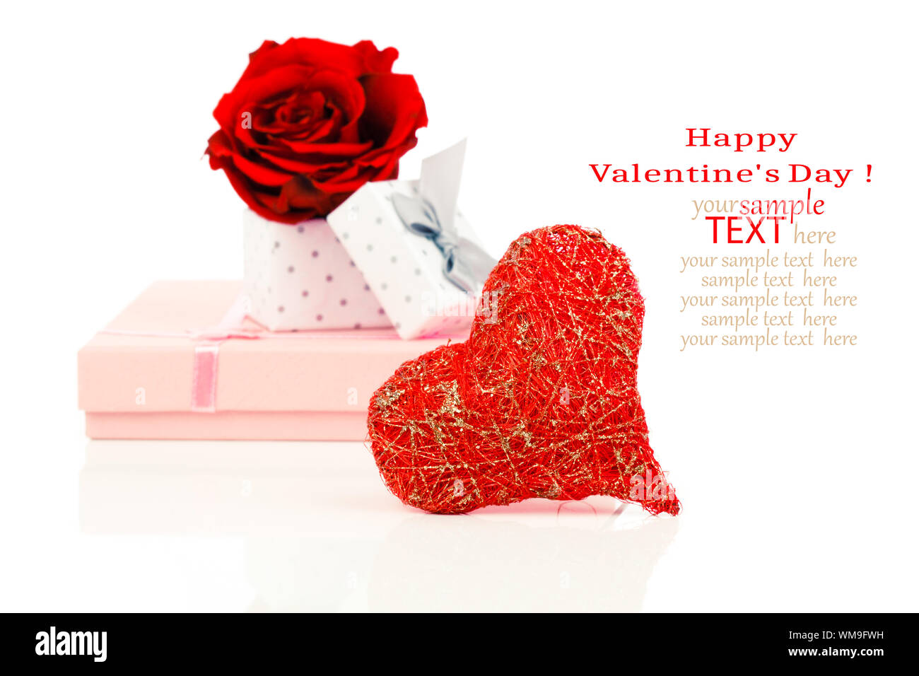 Red heart shape symbol made from thread with gift on white background ...