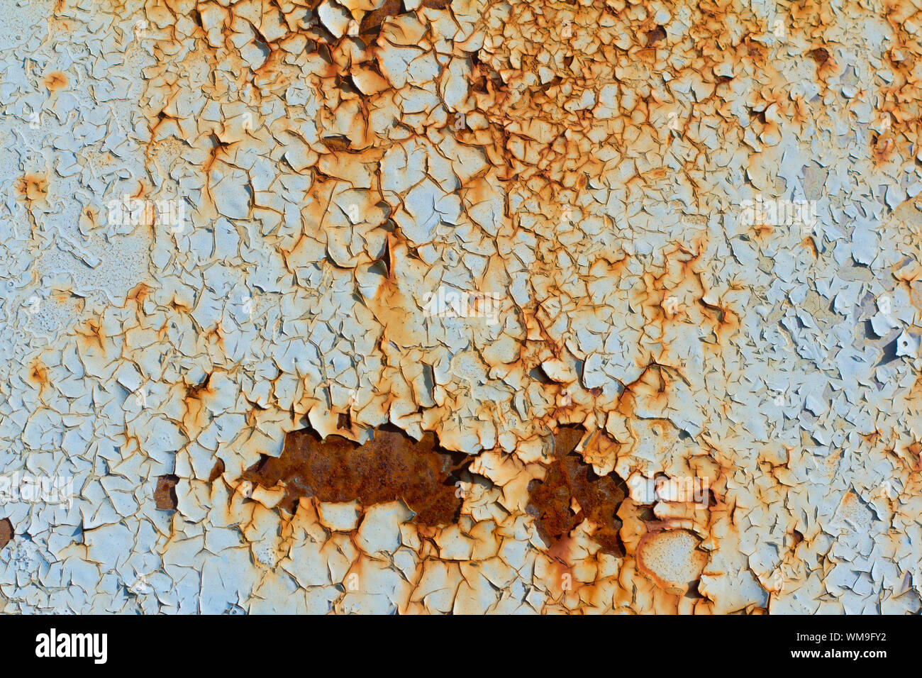 Rust, rusty background, rusty metal texture with remnants of blue paint ...