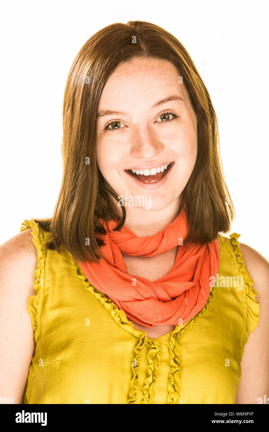 Pretty girl with a amused expression on white background Stock Photo ...