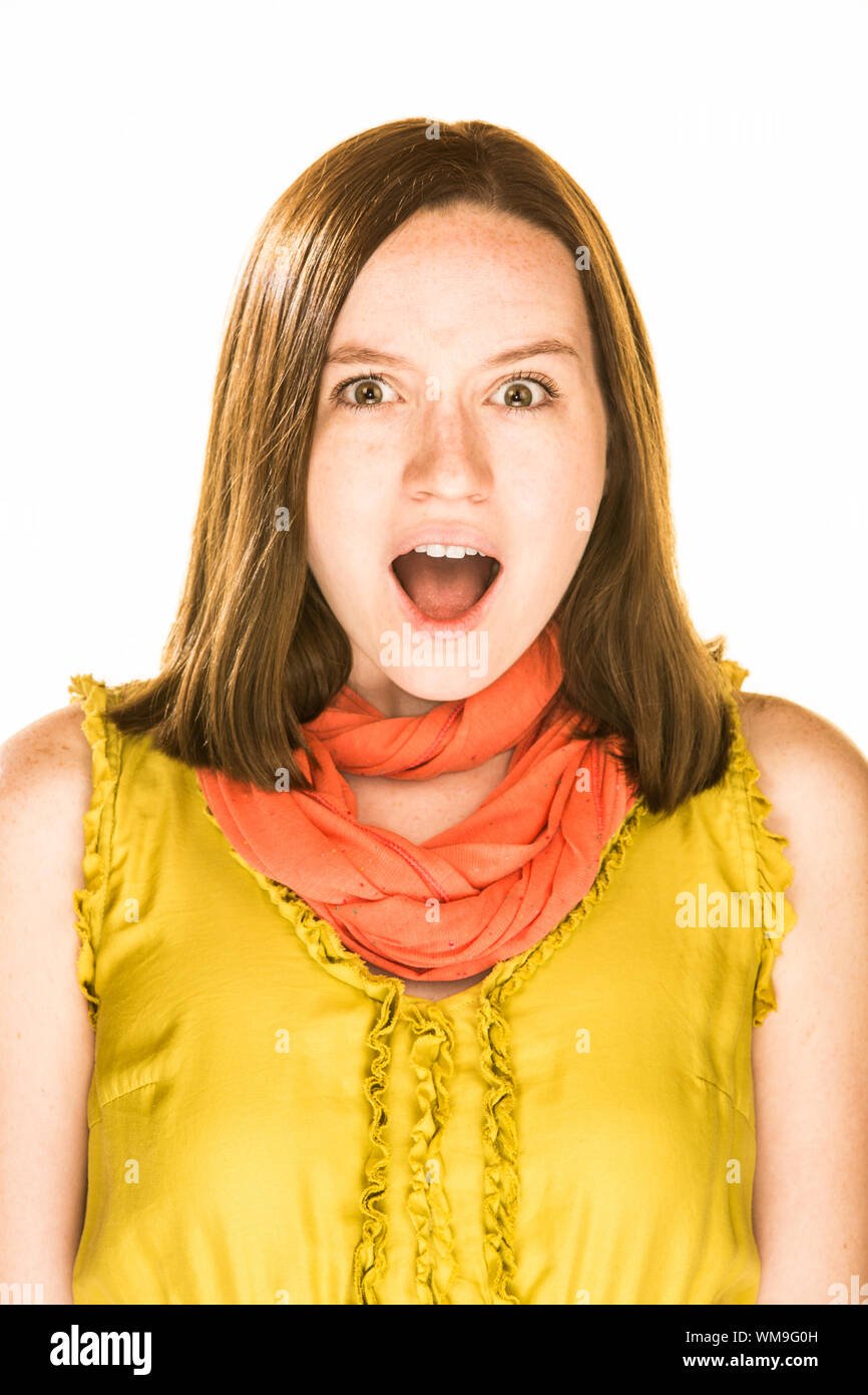 Pretty girl with a shocked expression on white background Stock Photo ...