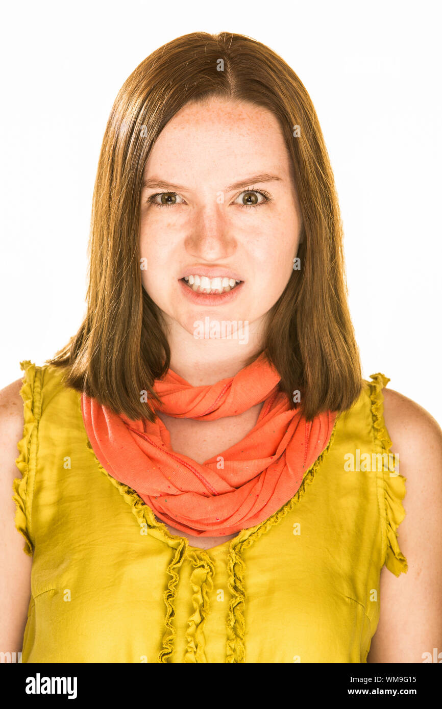 Pretty girl with a very angry expression on white background Stock ...