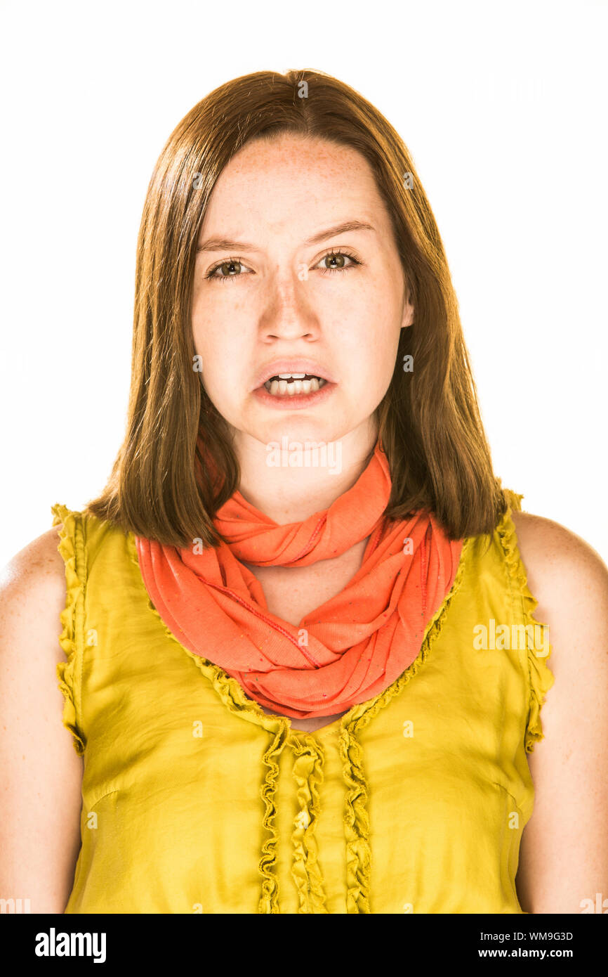 Pretty girl with a sad expression on white background Stock Photo - Alamy