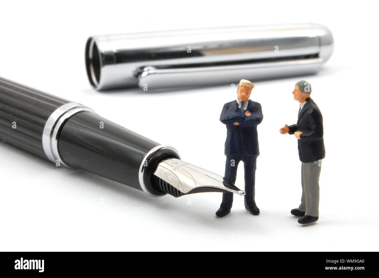 business man and pen isolated on white background Stock Photo - Alamy