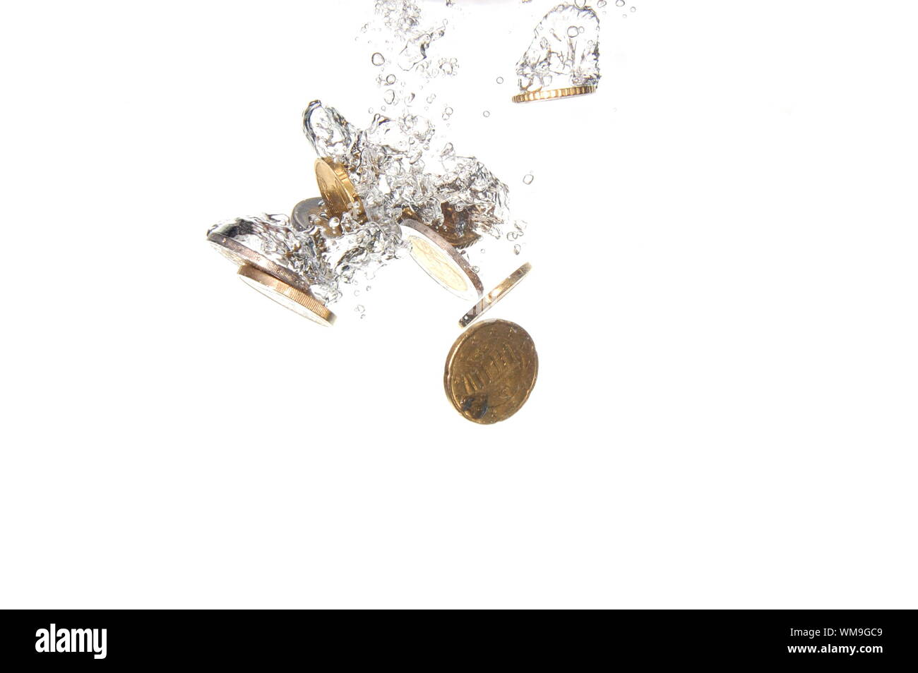 money in water with bubbles on white background Stock Photo - Alamy