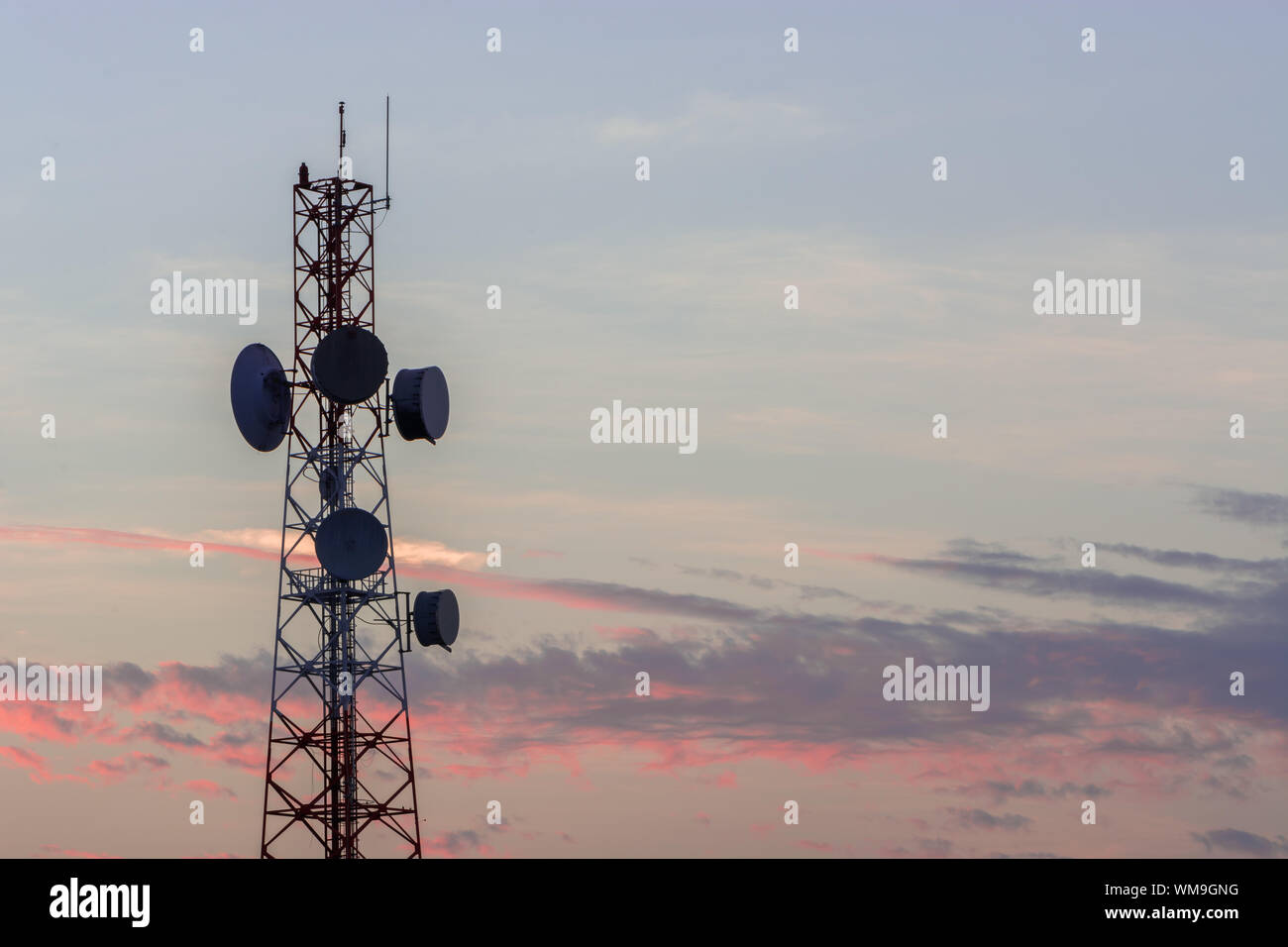 Telecommunication tower structure with sunset sky background Stock ...