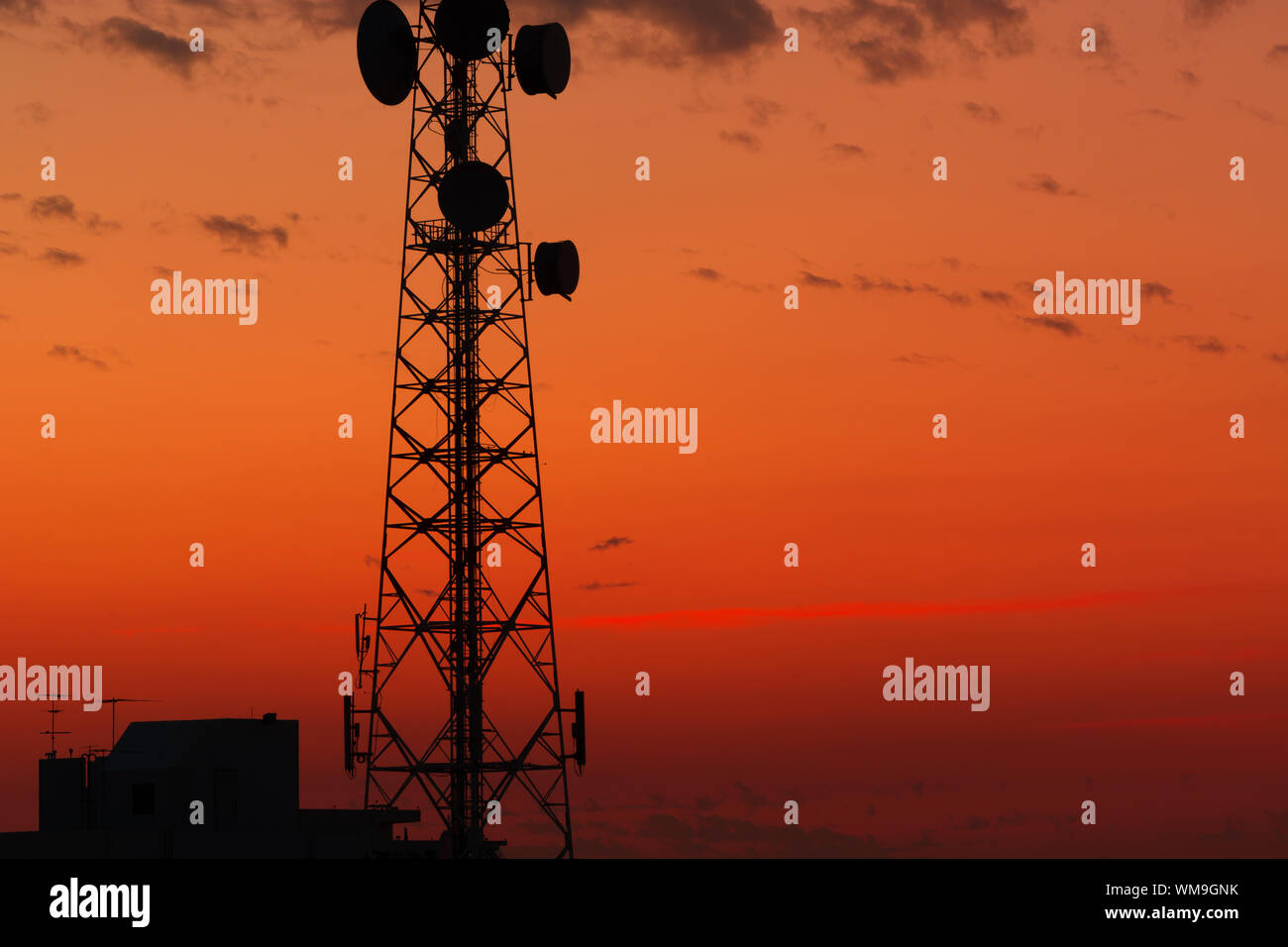 Telecommunication tower structure with sunset sky background Stock Photo - Alamy