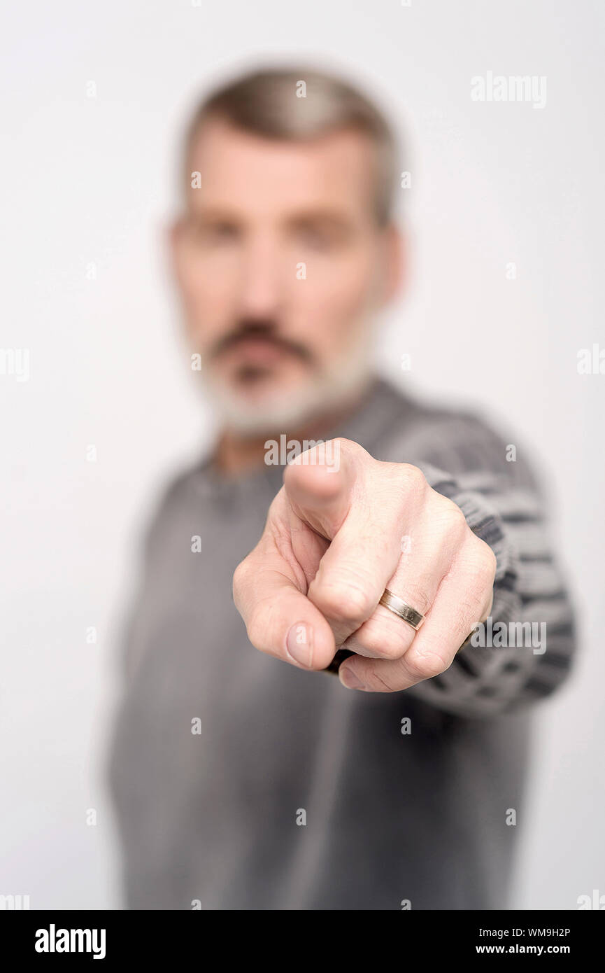 Senior man pointing his finger towards camera Stock Photo - Alamy