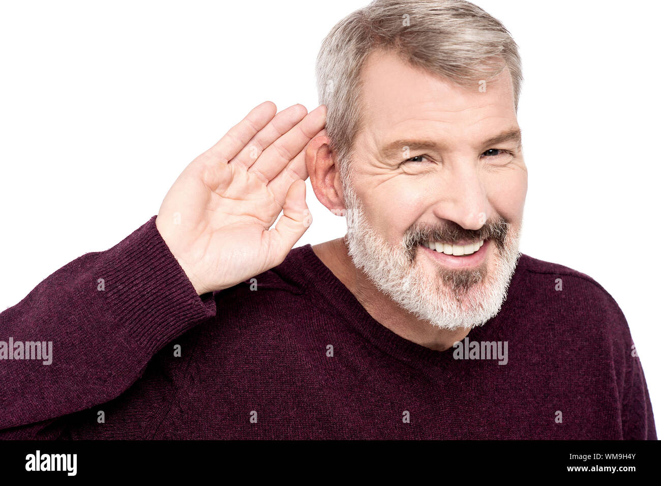 Mature man cupping hand behind ear Stock Photo - Alamy