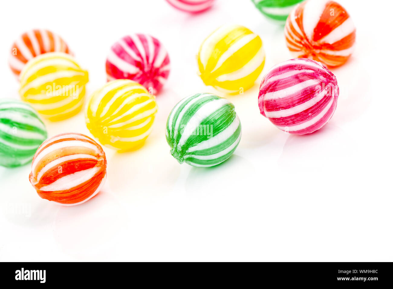 colored candies isolated on white Stock Photo - Alamy