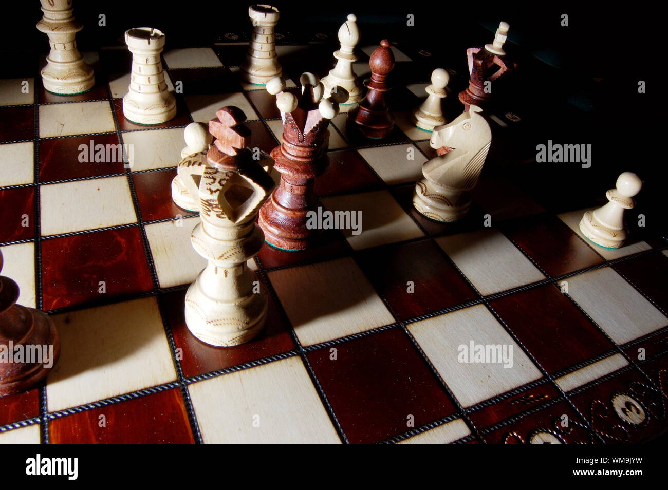 chess pieces on chess board showing power and success Stock Photo - Alamy