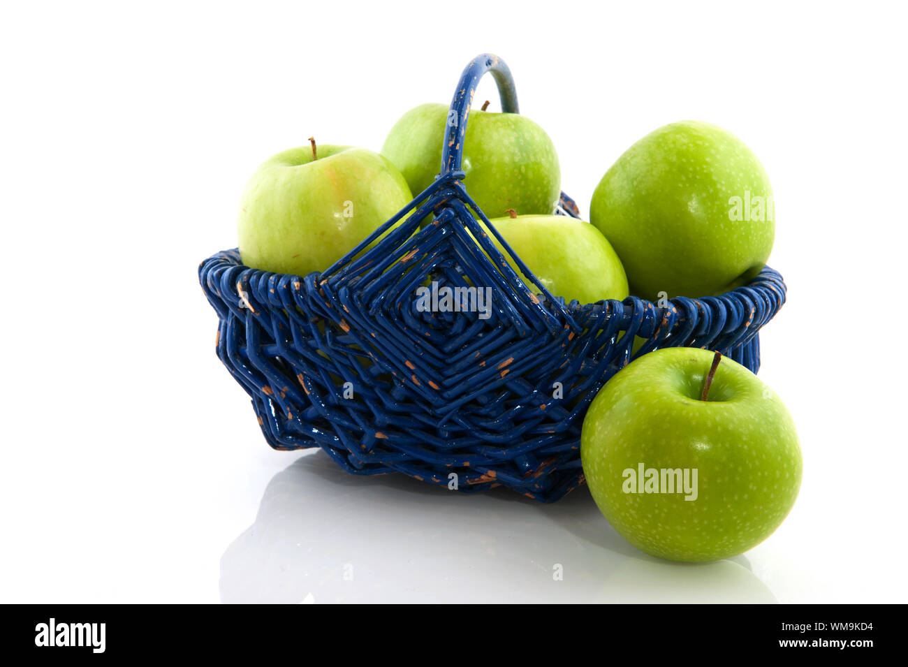 Green plucked apples in a blue basket Stock Photo - Alamy