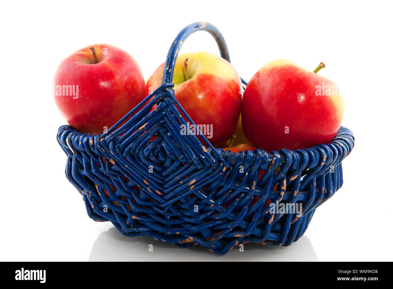 Red plucked apples in a blue basket Stock Photo - Alamy