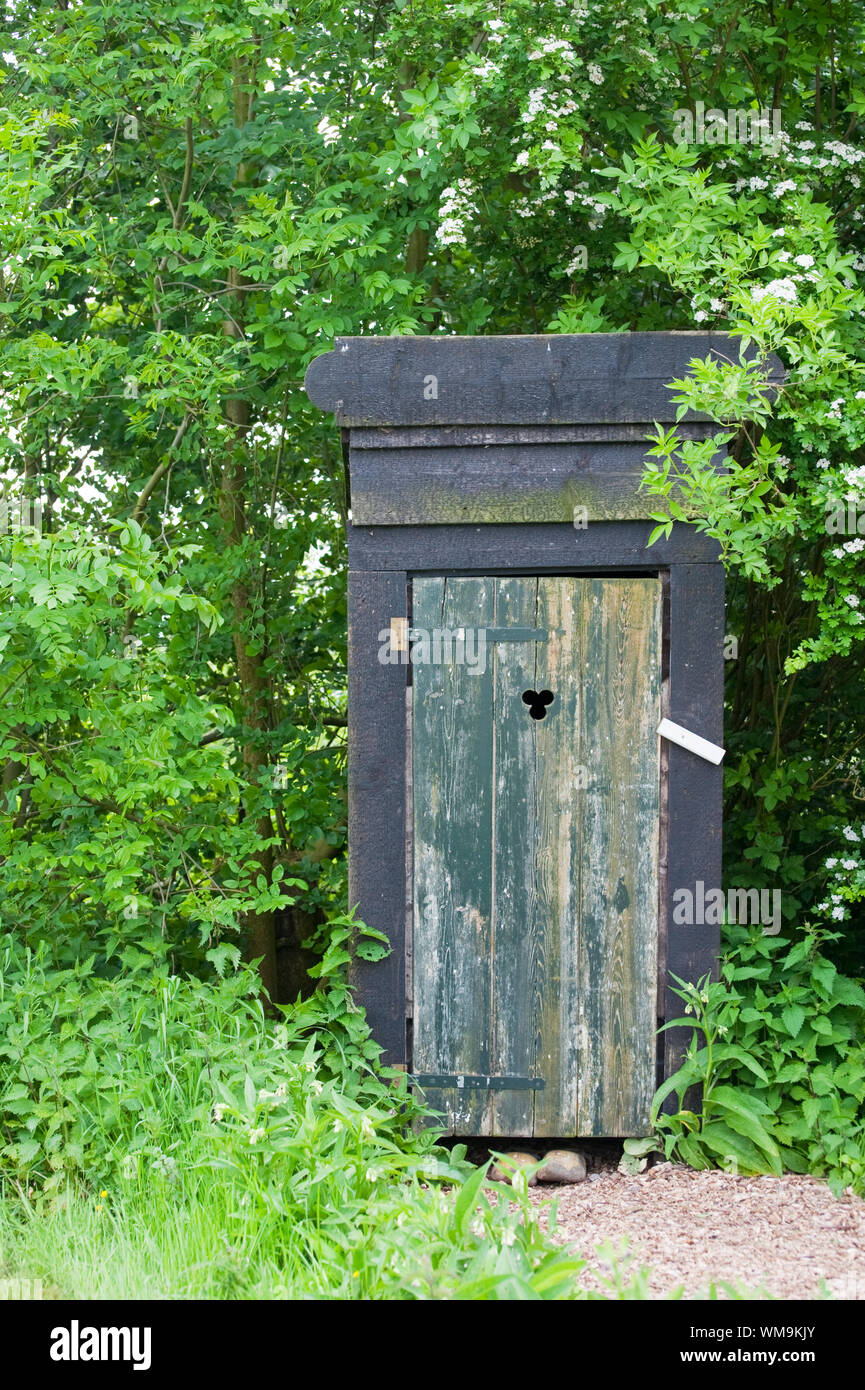 Old wooden Dutch toilet in the garden outdoor Stock Photo - Alamy