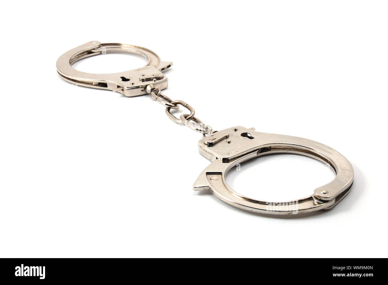 police handcuffs isolated on a white background Stock Photo - Alamy