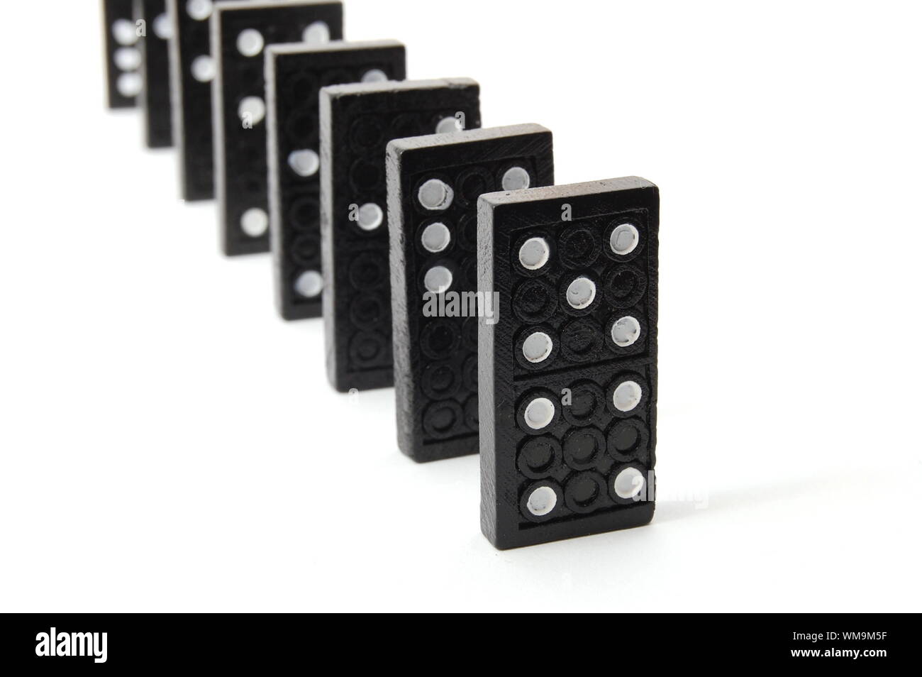 chain of dominoes isolated on a white background Stock Photo - Alamy
