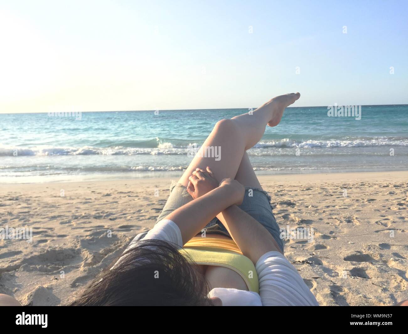 Woman lying on back in sea hi-res stock photography and images - Alamy