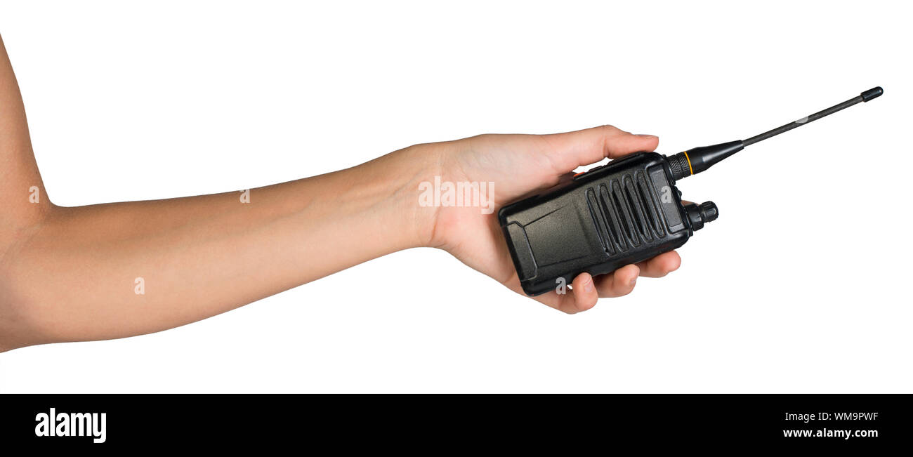 Female hand, bare, holding portable radio transmitter, isolated over ...
