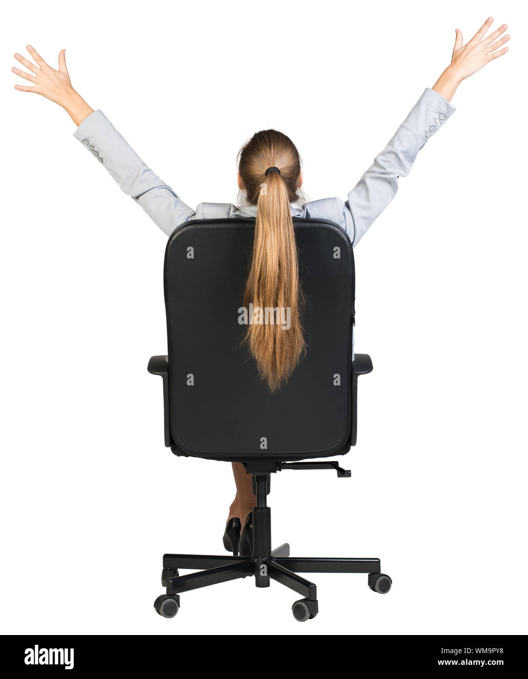 Businesswoman sitting back in her chair with her hands stretched out ...