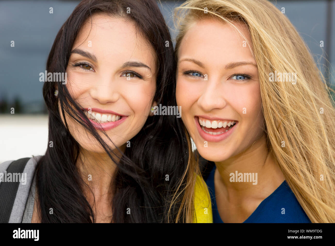 Portrait of a beautiful two young girls smiling Stock Photo - Alamy