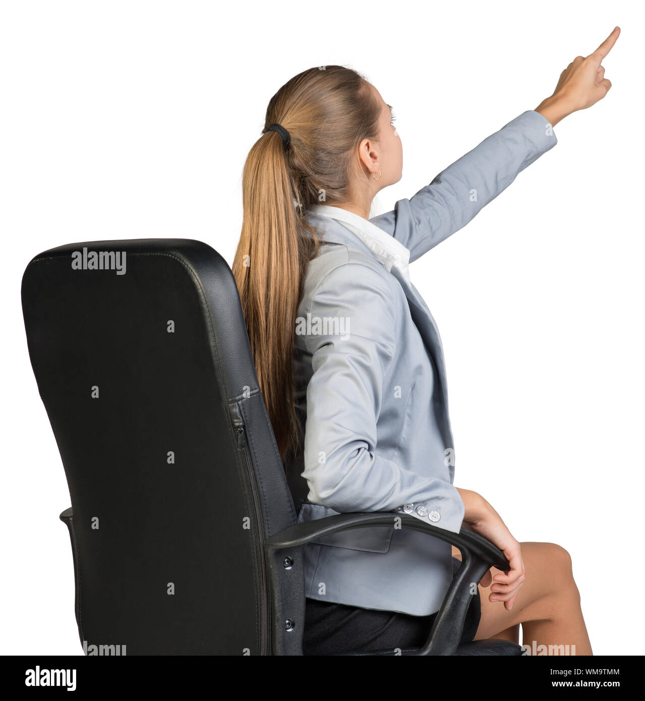 Businesswoman on office chair, pointing finger up and ahead. Isolated ...