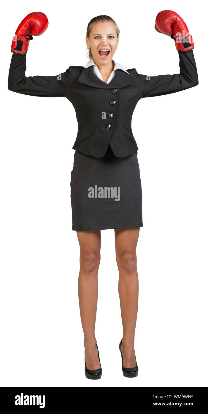 Businesswoman wearing boxing gloves standing in victory pose, looking ...