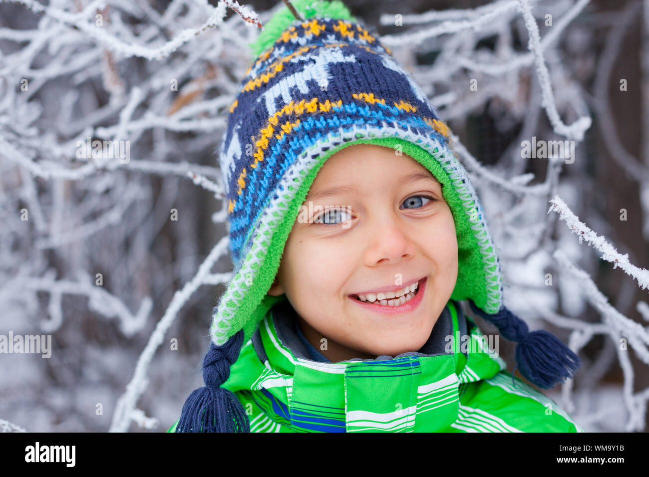 Portrait of a little boy in the snow Stock Photo - Alamy