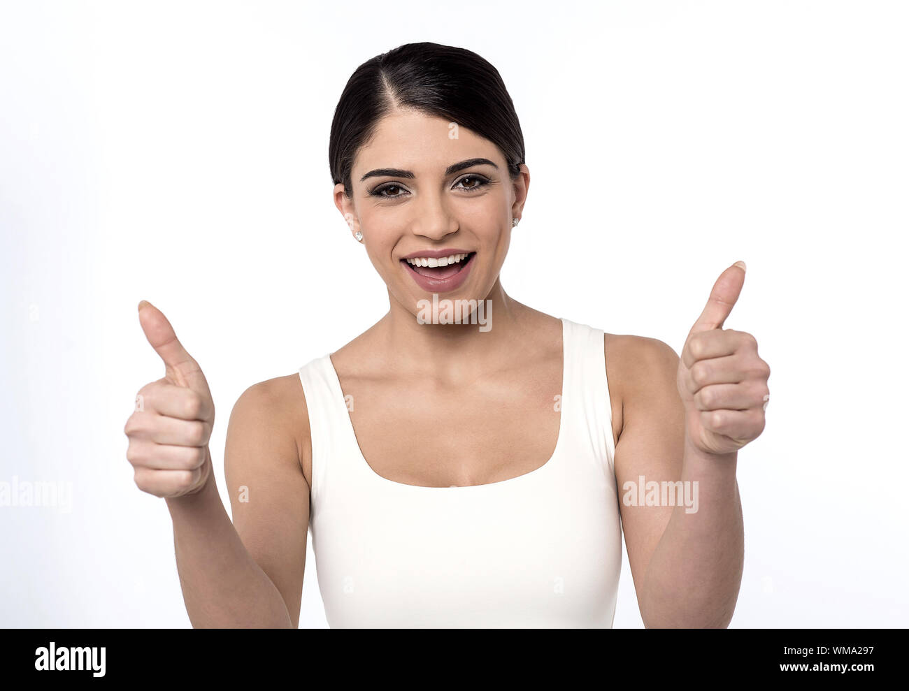 Happy woman making thumb up gesture by two hands Stock Photo - Alamy