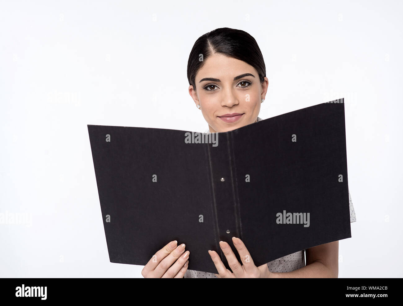 Beautiful female executive with folder in hands Stock Photo - Alamy