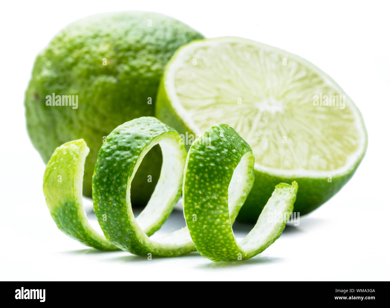 Ripe lime fruits on the white background Stock Photo - Alamy