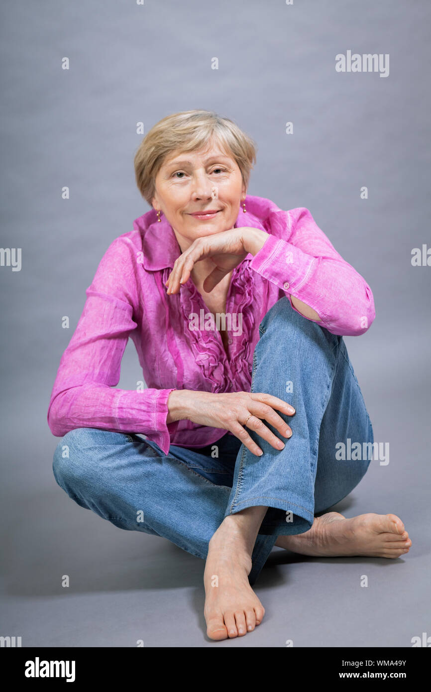 Clasping her knee hi-res stock photography and images - Alamy