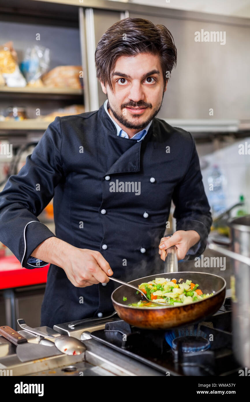 Person frying vegetables cooking hi-res stock photography and images ...