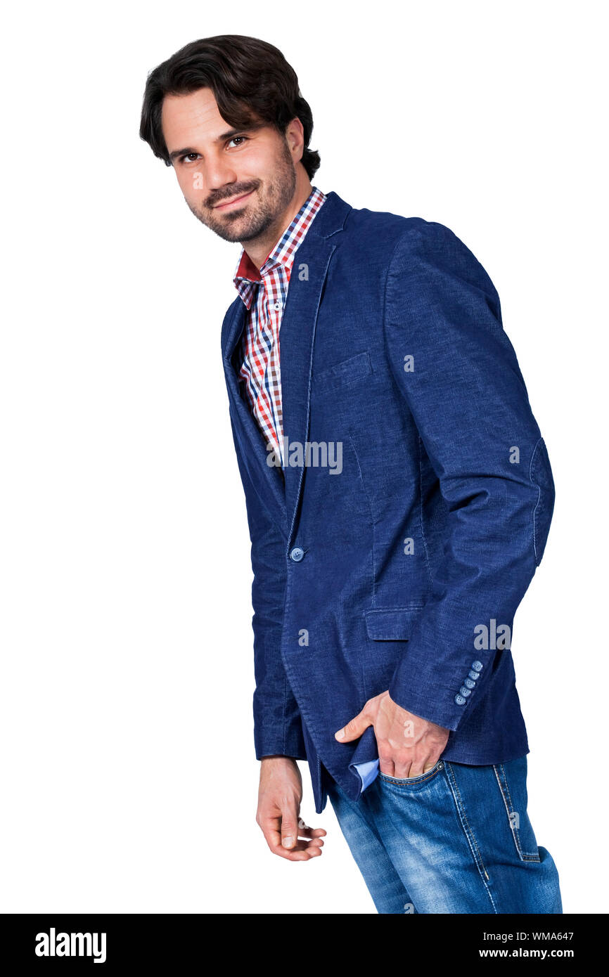 Handsome smiling man in stylish leisurewear approaching the camera in a ...