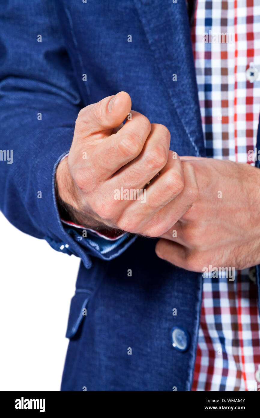 Handsome smiling man in stylish leisurewear approaching the camera in a ...