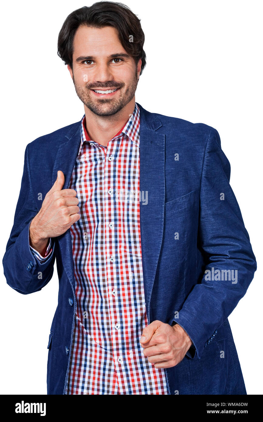 Handsome smiling man in stylish leisurewear approaching the camera in a ...