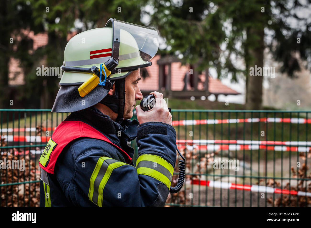 Looking away standing holding protection safety fence hi-res stock ...