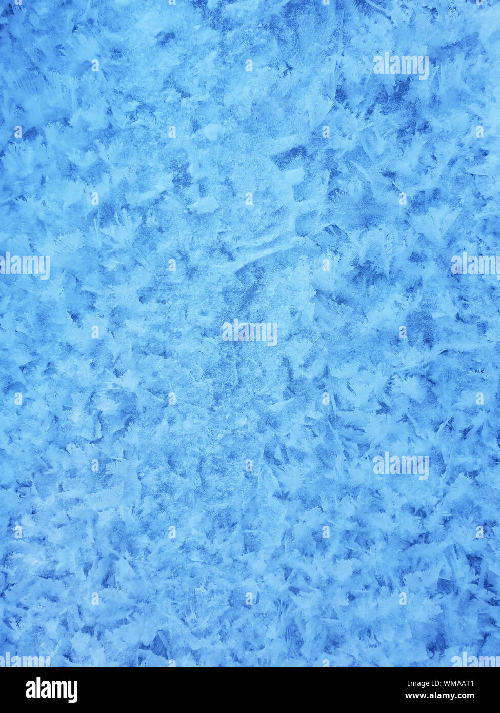 Snow crystals form beautiful snow pattern on frozen icy river ...