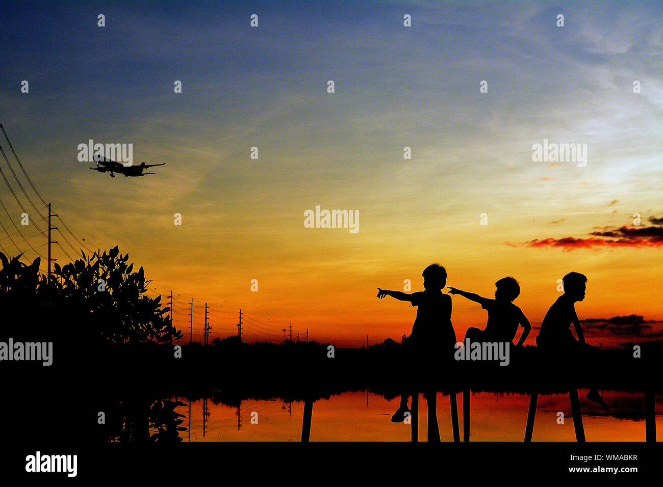 Pointing at the sunset hi-res stock photography and images - Alamy