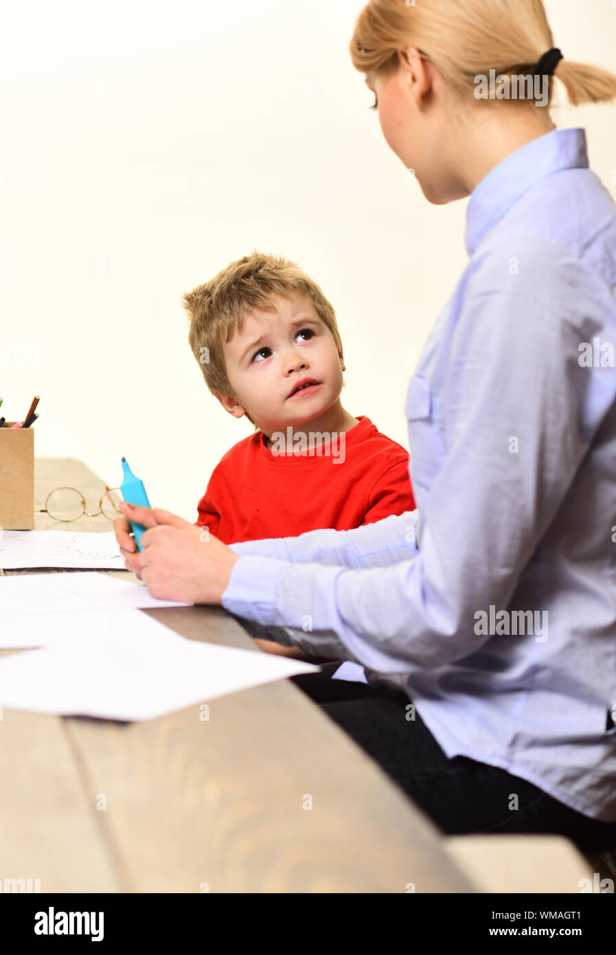 Teacher or tutor helps preschool child, High school college students ...