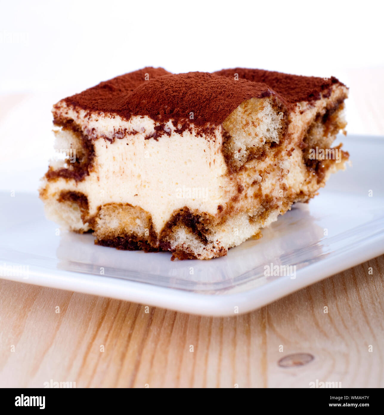 Portion of tiramisu on a plate Stock Photo - Alamy